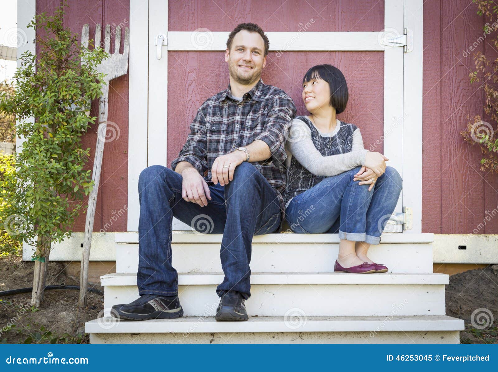 Mixed Race Couple Relaxing on the Steps Stock Image - Image of ethnic ...