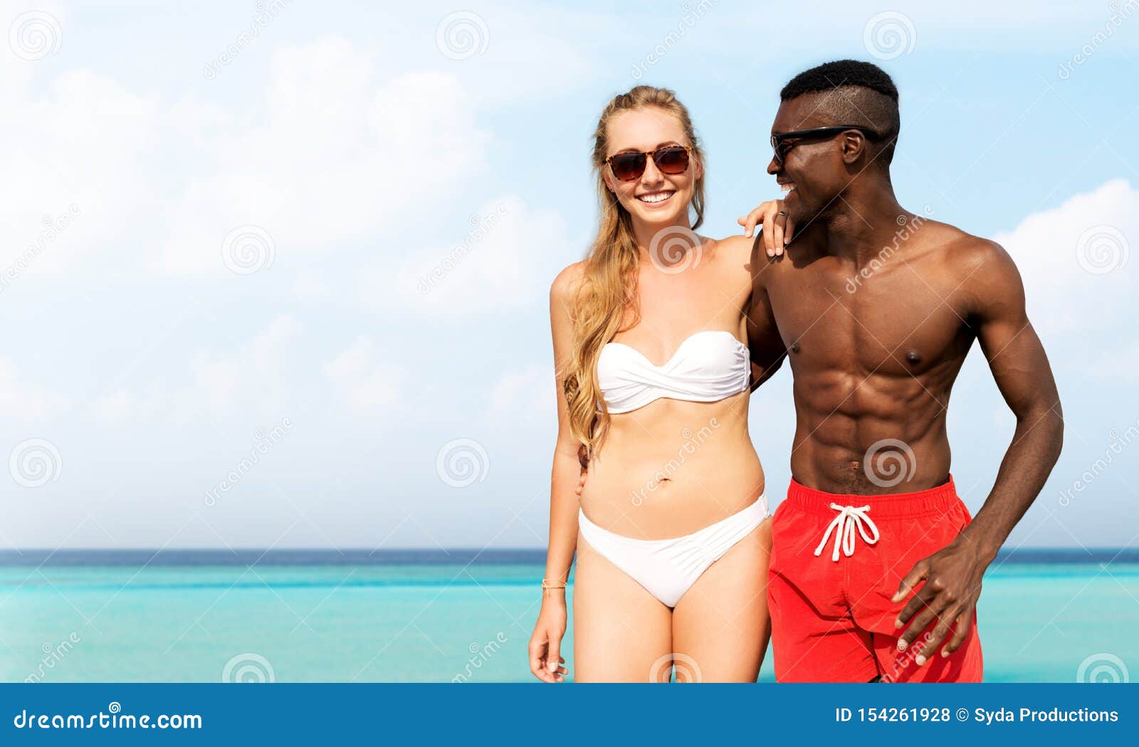 Mixed Race Couple Walking Along Beach with Friends Stock Photo - Image ... Mixed Race Couple Walking Along Beach with Friends Stock Photo - Image ...