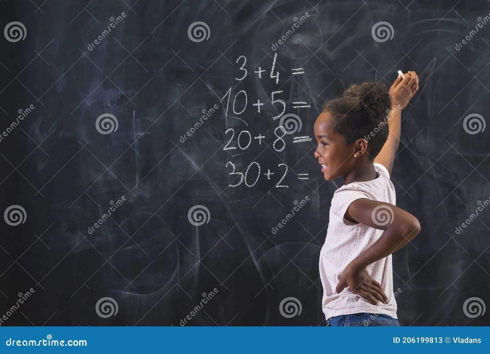 Mixed Race Elementary School Girl Solving Math Problems on Chalkboard ...