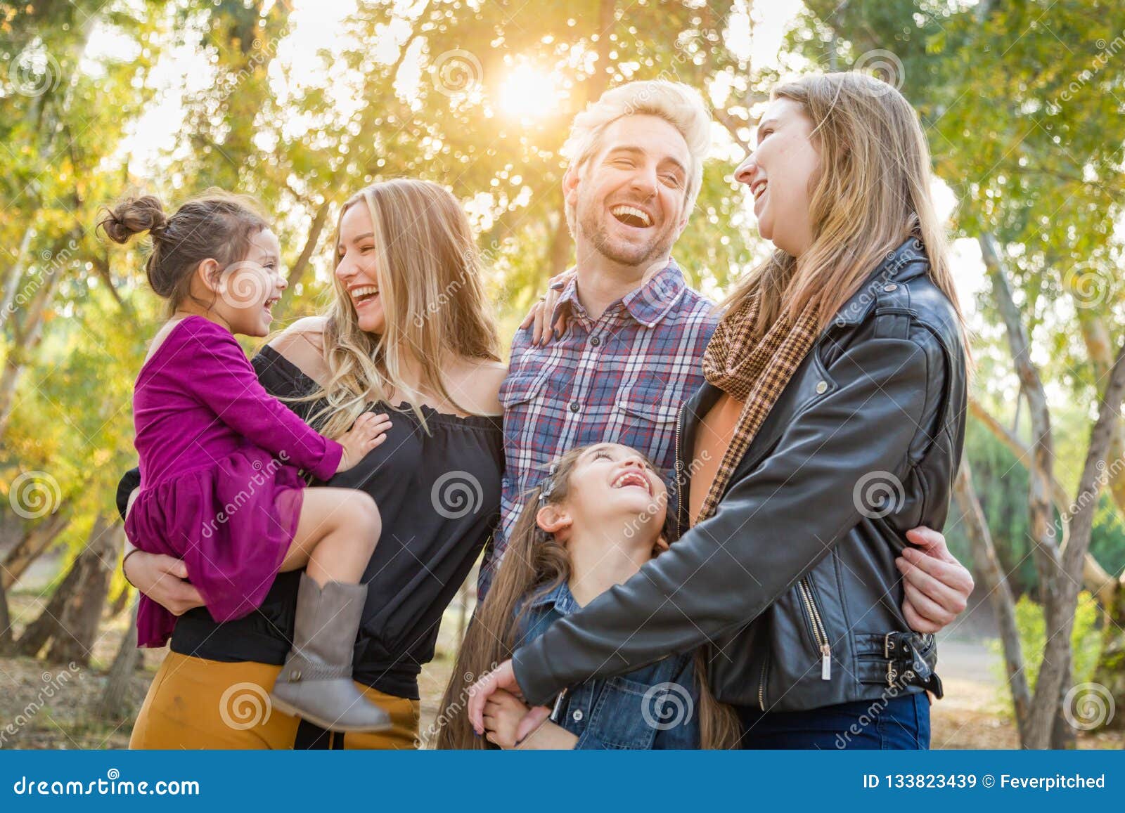 Mixed Race Family Members Having Fun Outdoors Stock Image - Image of ...