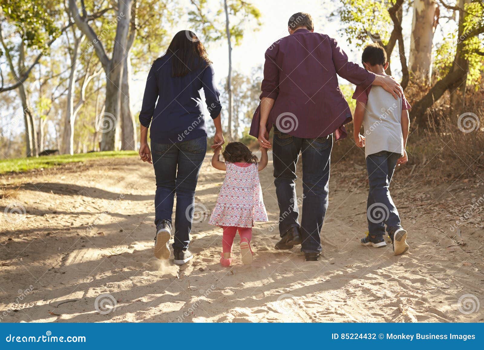 Mixed Race Family Walking on Rural Path, Close Up Back View Stock Photo ...