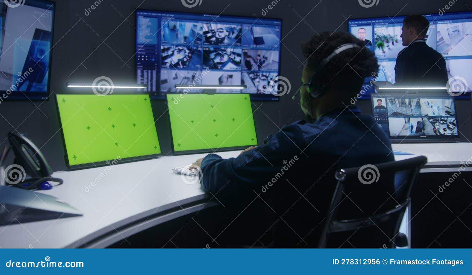 Mixed Race Officers, Operators Control Security Cameras Stock Photo ...
