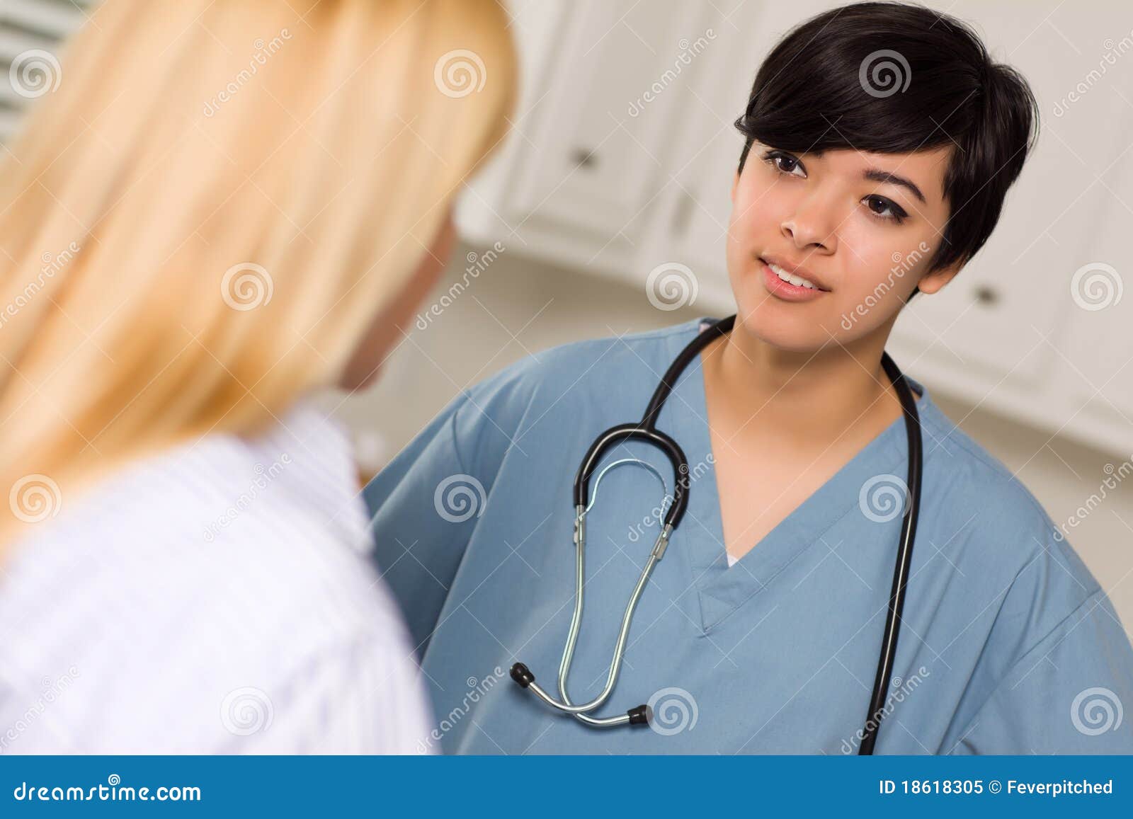 Mixed Race Young Female Doctor and Patient Stock Image - Image of ...