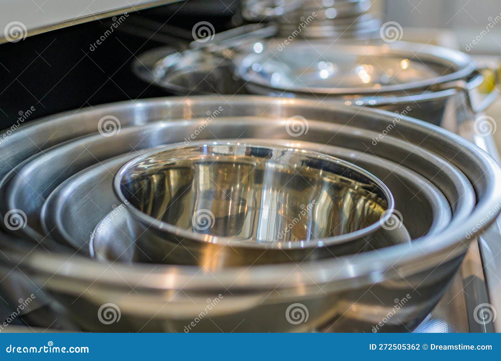 A Mixed Stack of Stainless Steel Bowls and Other Utensils. Stock Photo ...