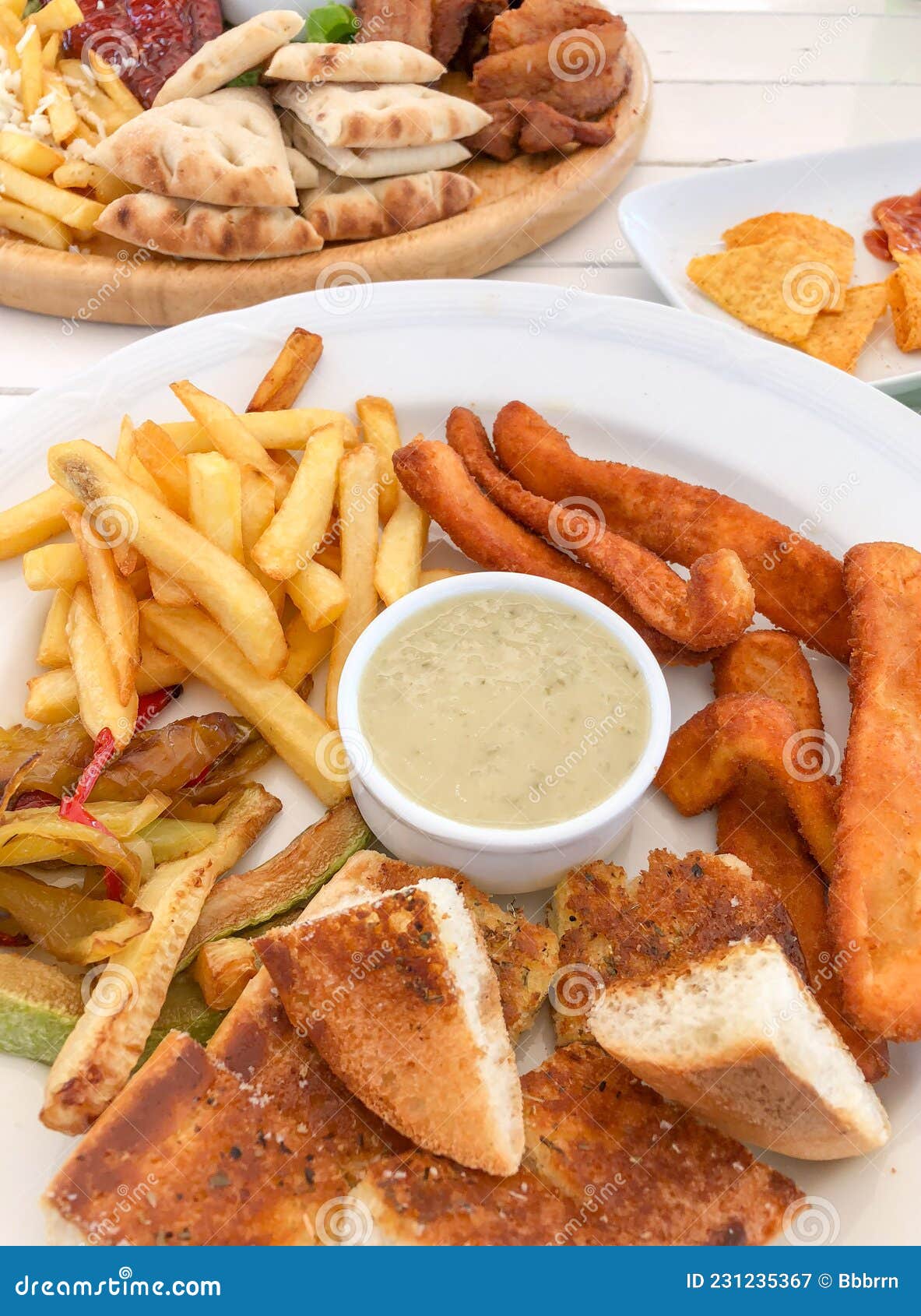 Mixed Starter Plate Served with Sauce on the Table Stock Image - Image ...