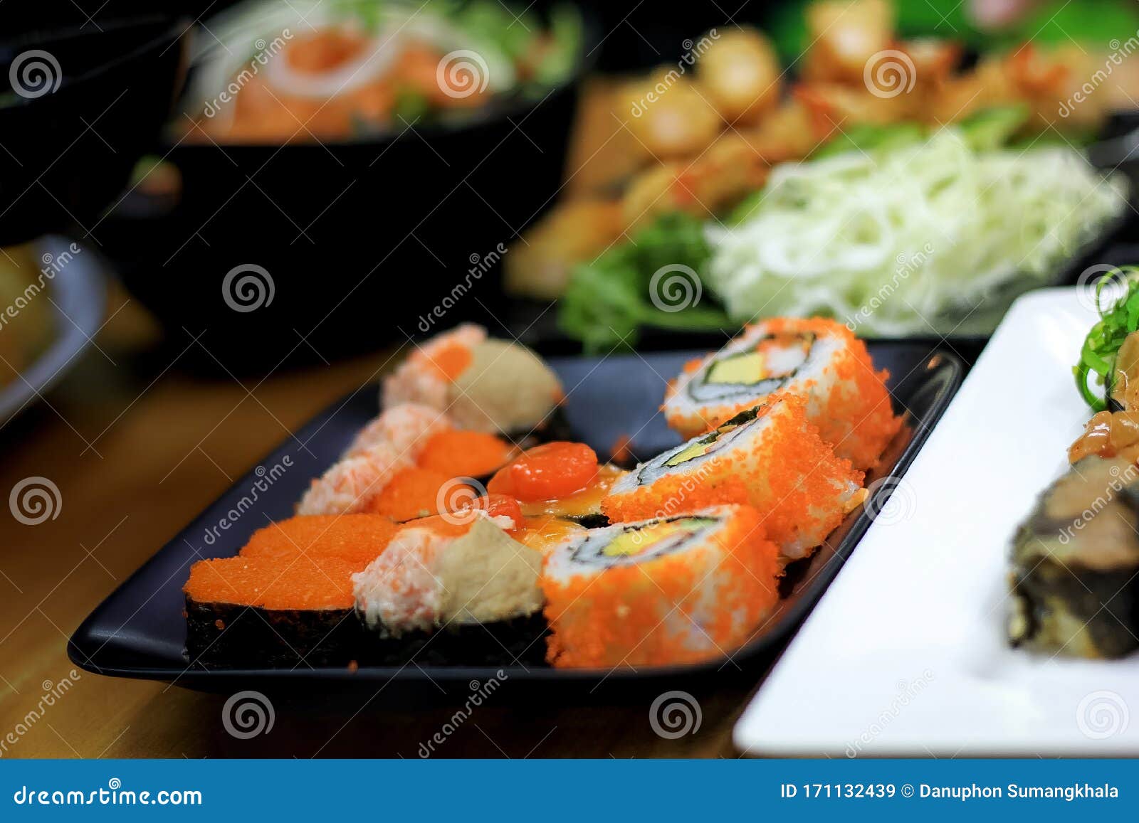 Mixed Sushi on a Plate in a Japanese Restaurant Stock Image - Image of ...