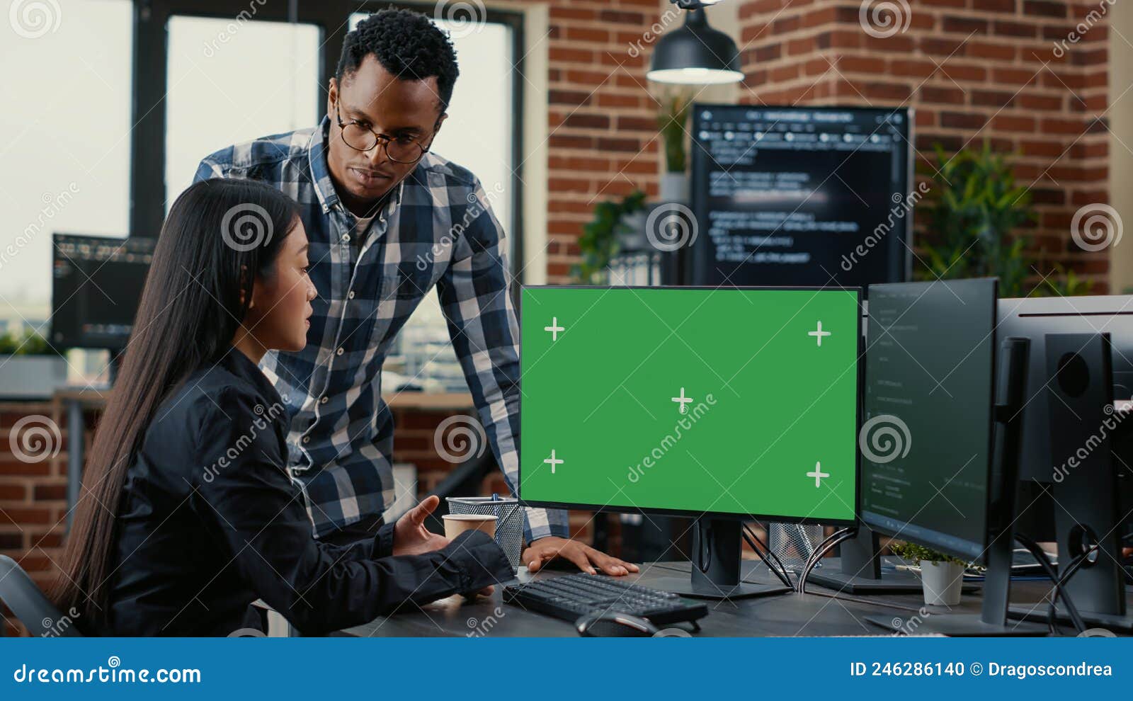 Mixed Team Of Programmers Analyzing Source Code Looking At Green Screen