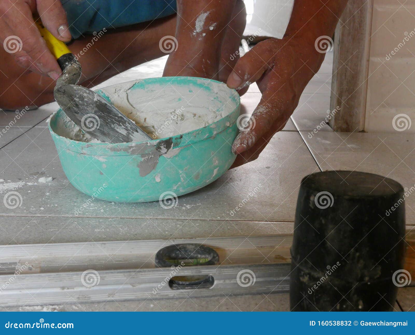 Mixed Tile Grout in a Plastic Bowl in a Construction Worker`s Hands ...
