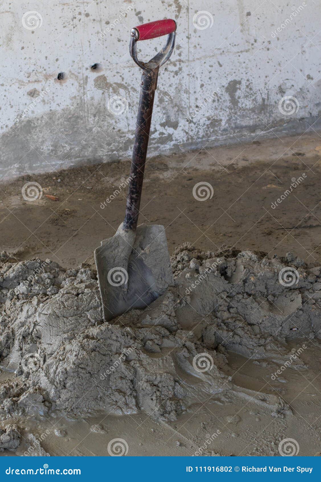 Wet cement and a spade stock photo. Image of concrete - 111916802