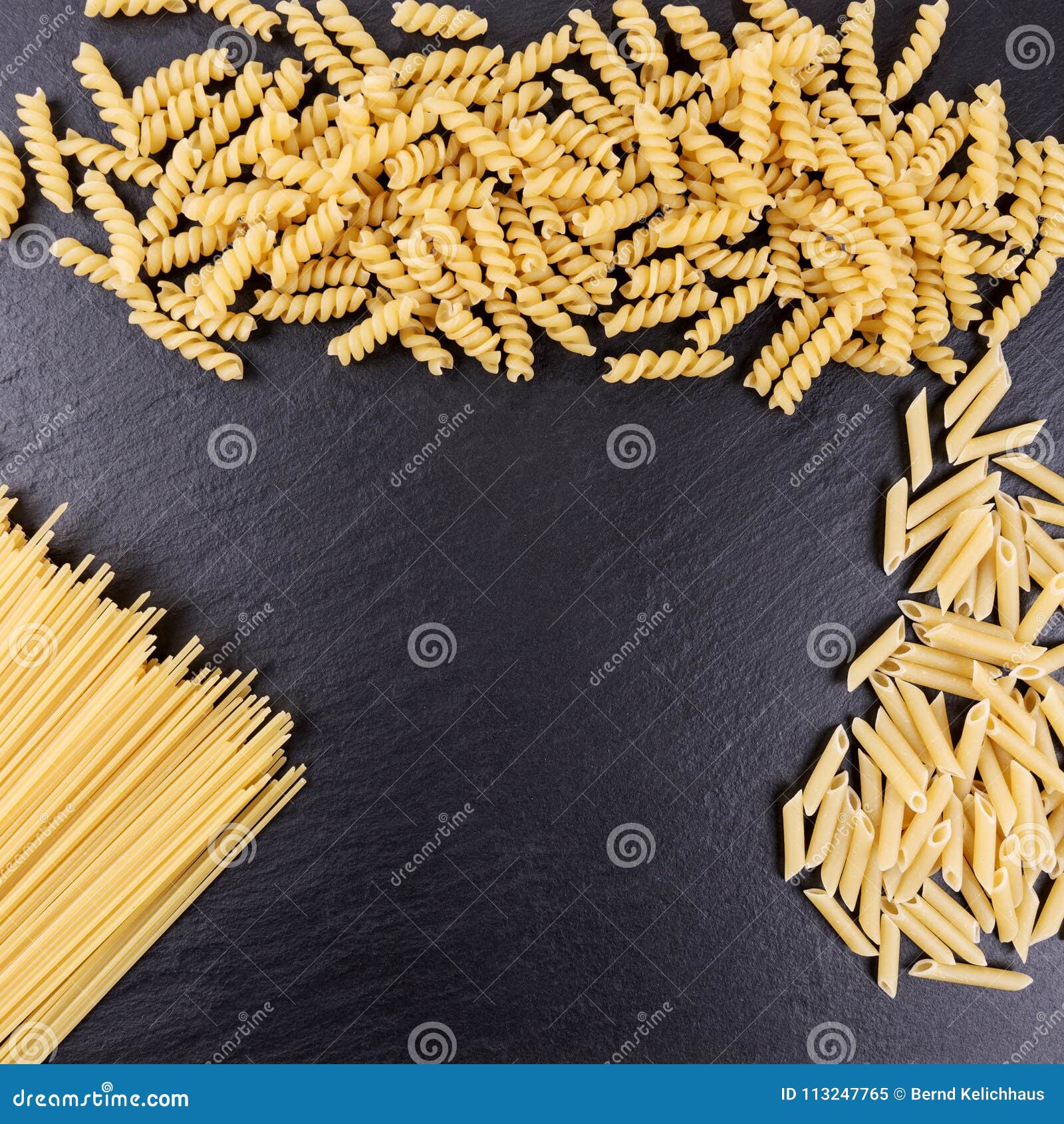 Mixed Yellow Pasta Varieties on Black Slate Plate Stock Image - Image ...