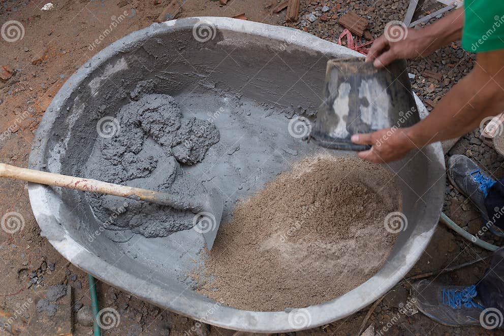 Mixing cement stock image. Image of sand, hand, plaster - 127946979