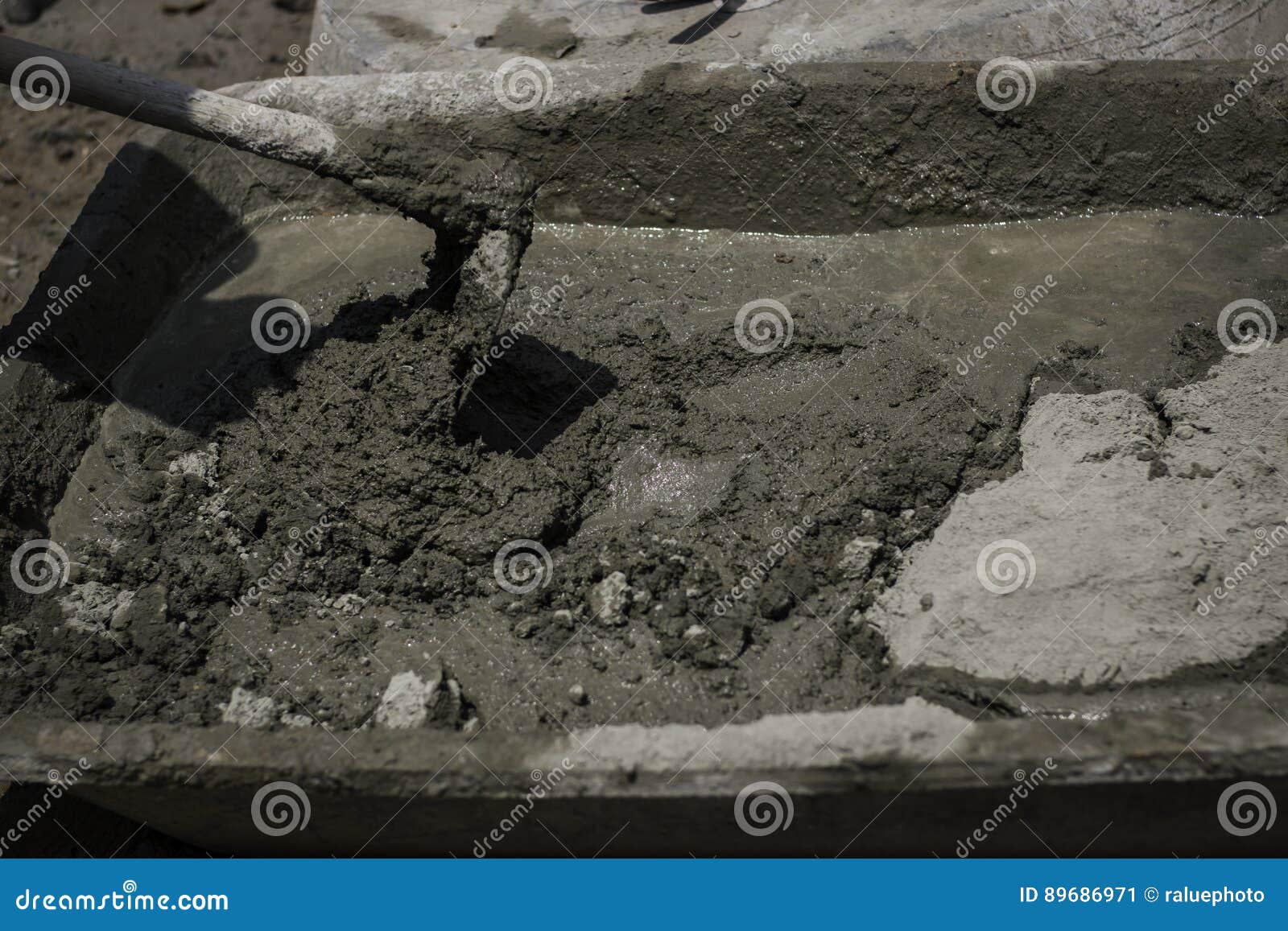 Mixing concrete with sand stock image. Image of concrete - 89686971