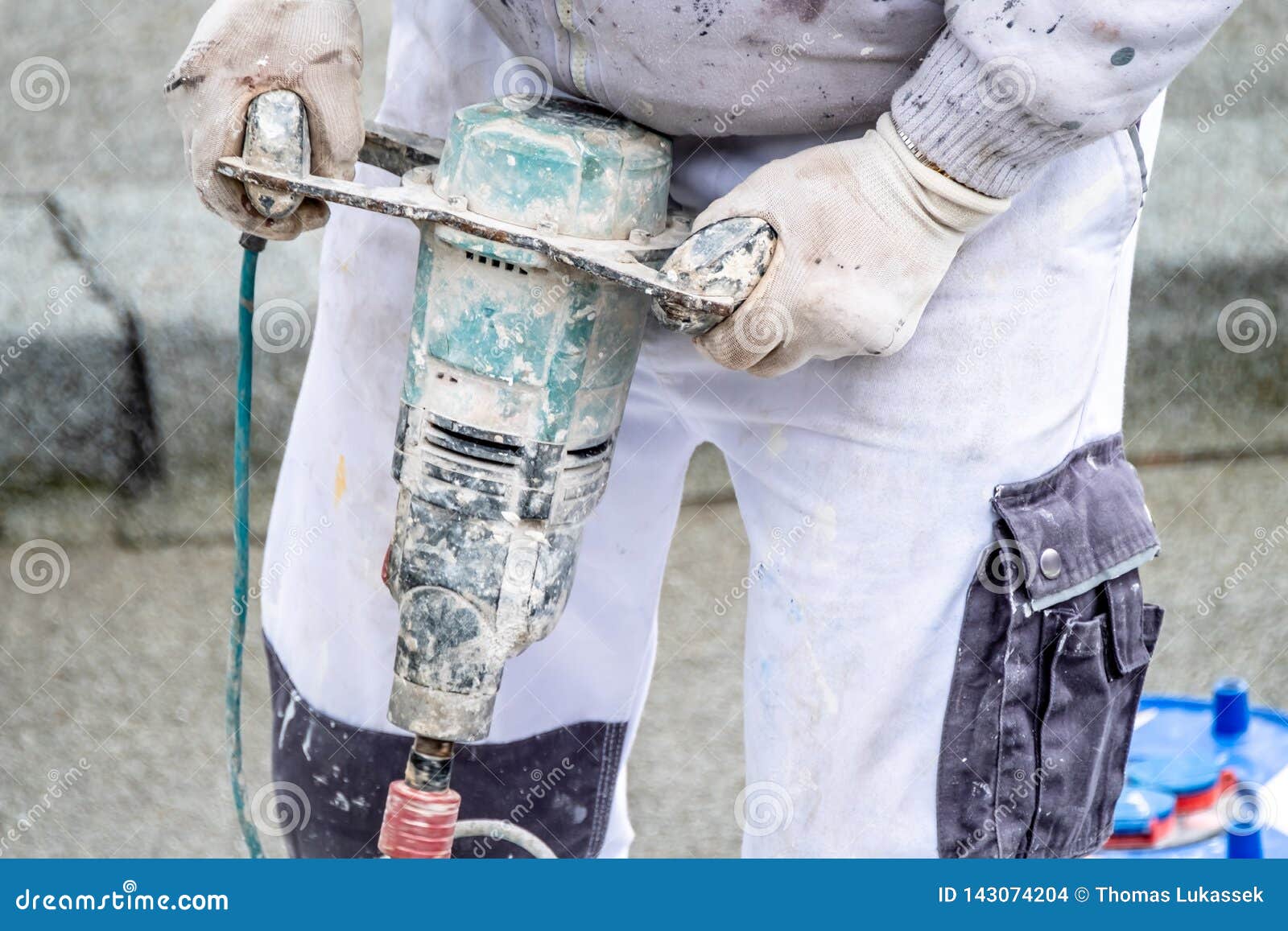 Mixing Plaster Solution in a Bucket, Using an Electric Drill Stock ...