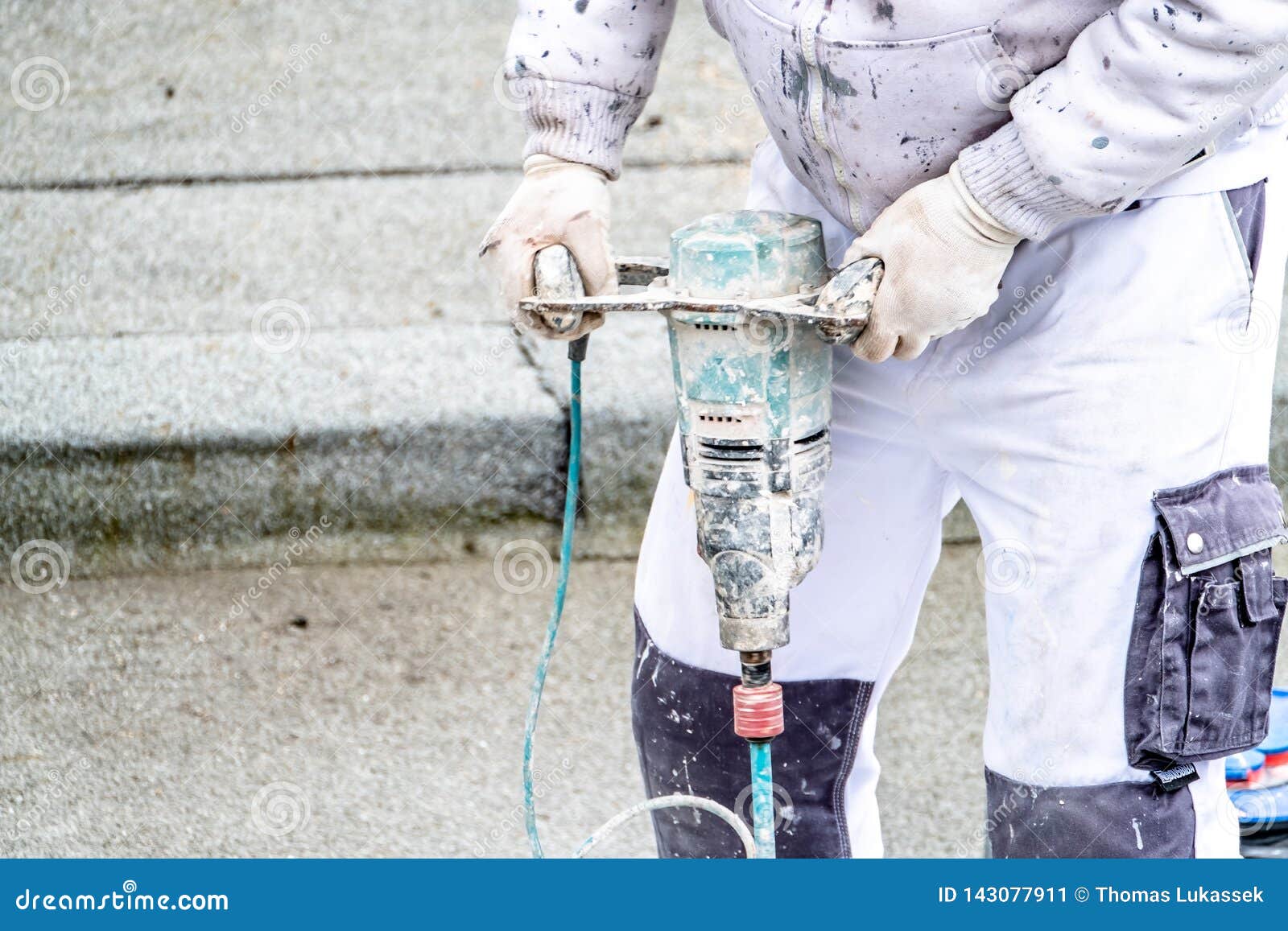Mixing Plaster Solution in a Bucket, Using an Electric Drill Stock ...