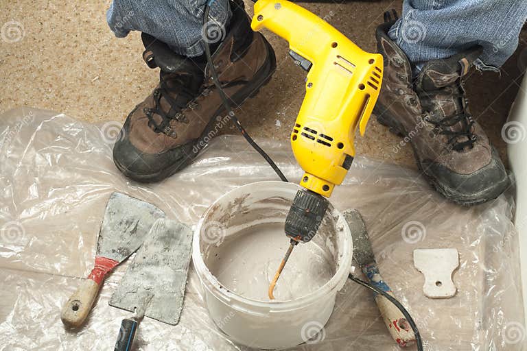 Mixing Plaster Solution in a Bucket,using Electric Drill Stock Photo ...