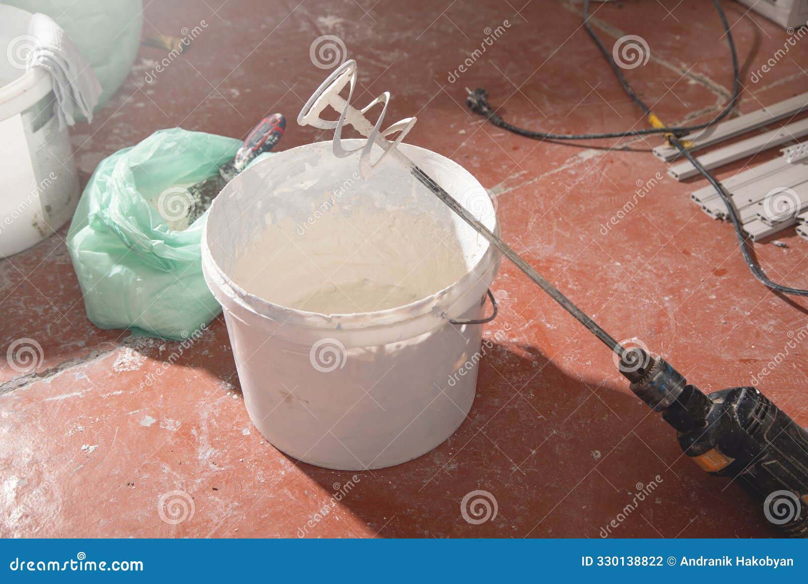 Mixing of Putty. Construction Mixer in a Bucket Stock Photo - Image of ...