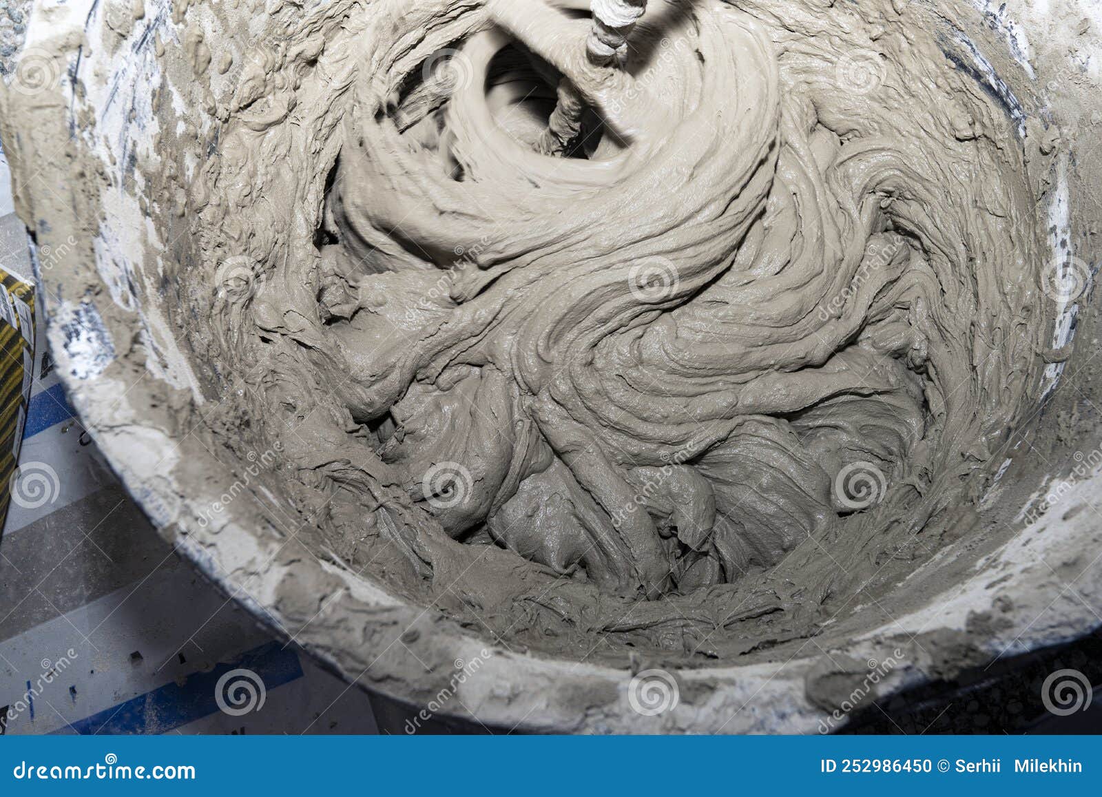 Mixing Tile Adhesive with a Construction Mixer Stock Photo - Image of ...