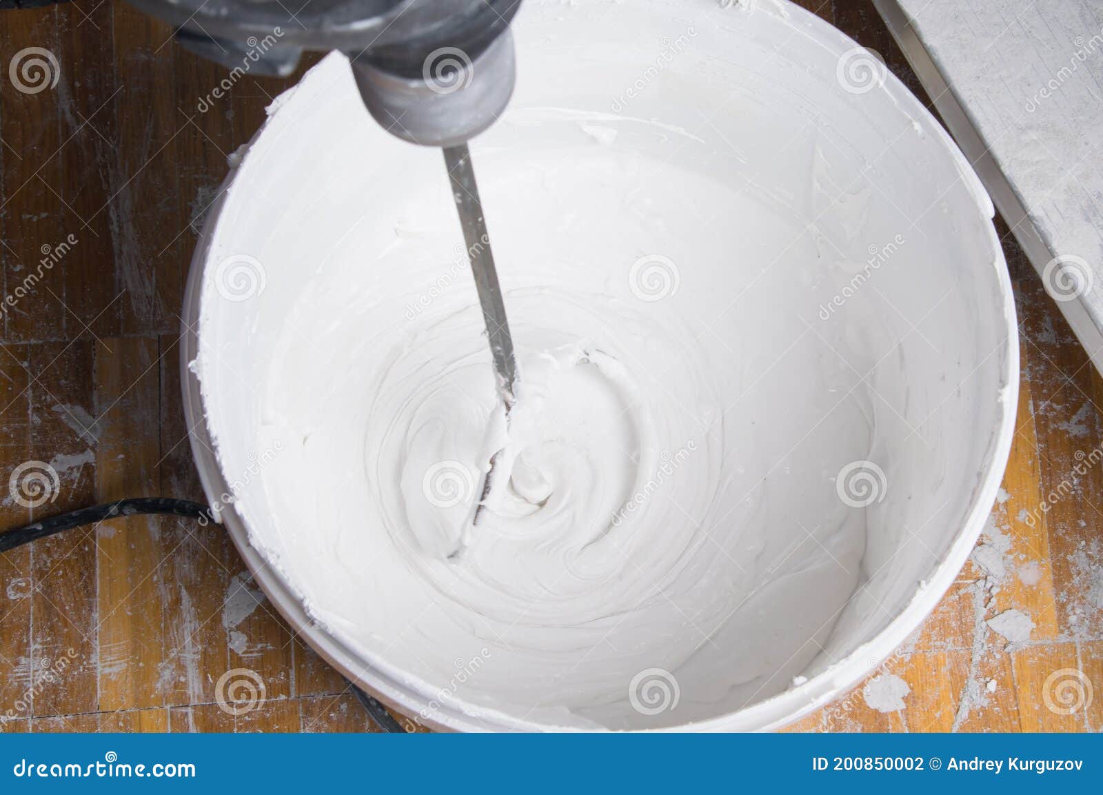 Mixing Wall Putty with a Whisk in a Bucket, for Finishing Application ...