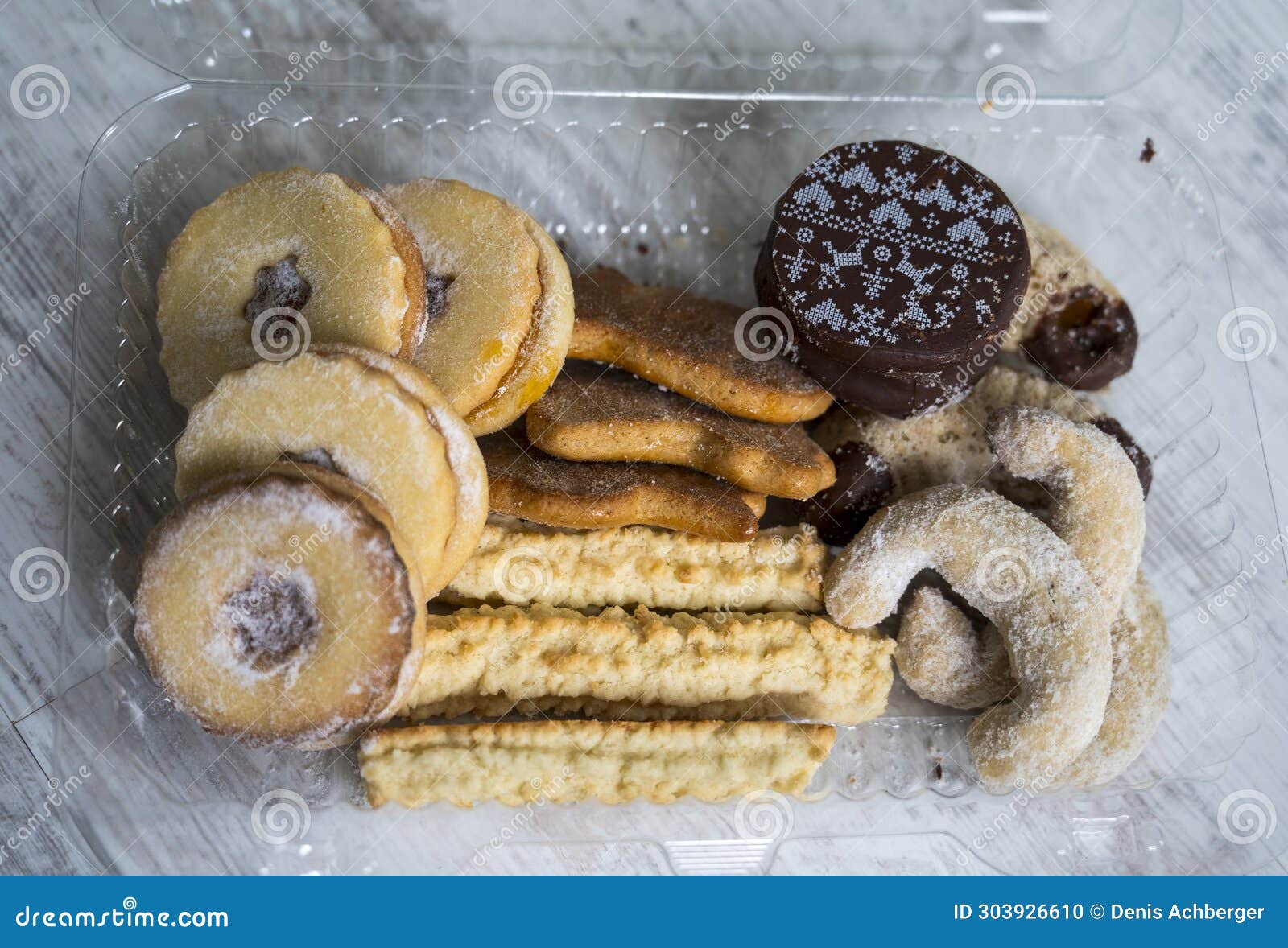 A Mixture of Different Types of Cakes in a Transparent Plastic Box ...