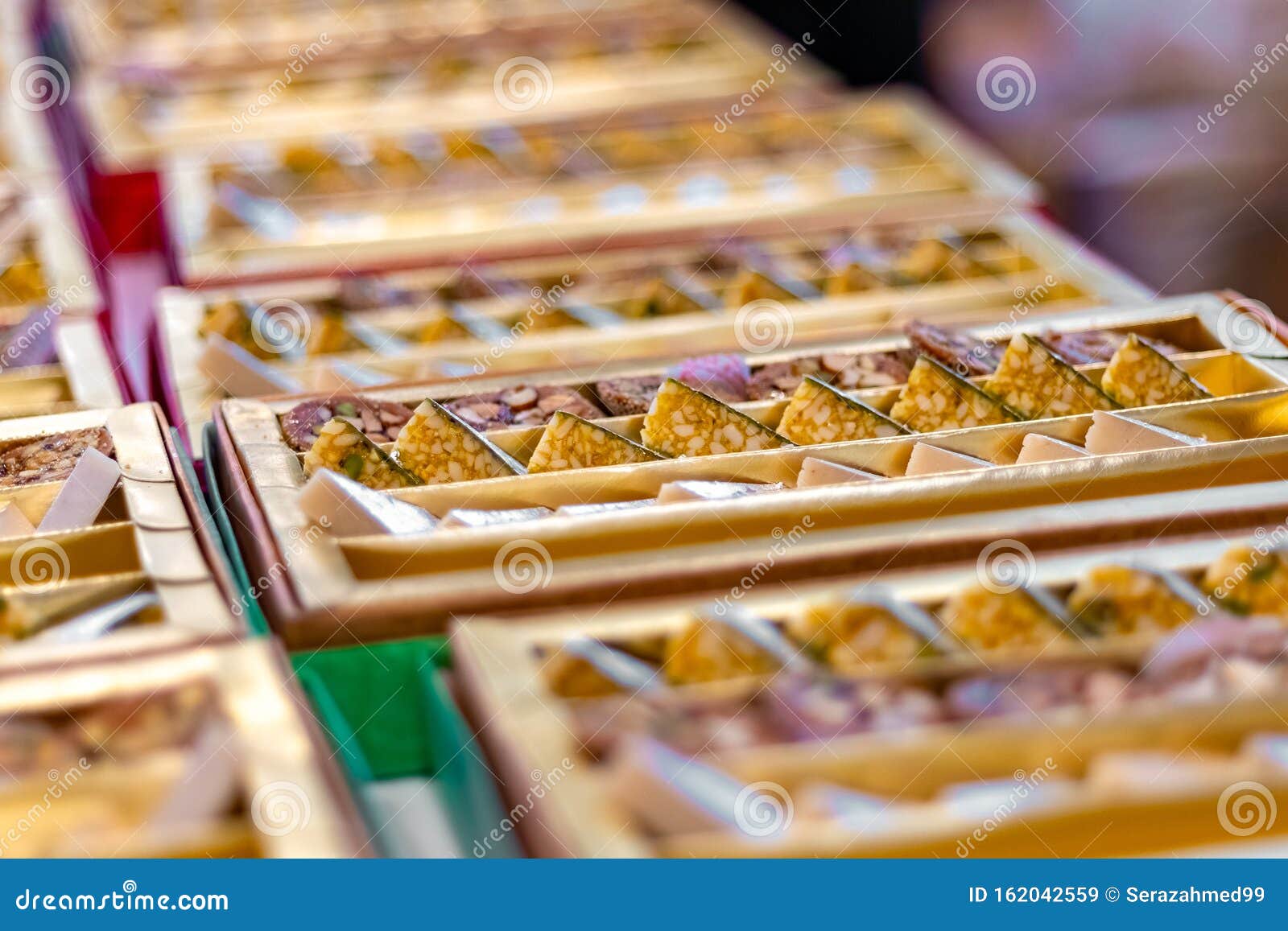 A Mixture of Various Indian Sweets Packed in a Box. Peda, Laddu, Mithai ...