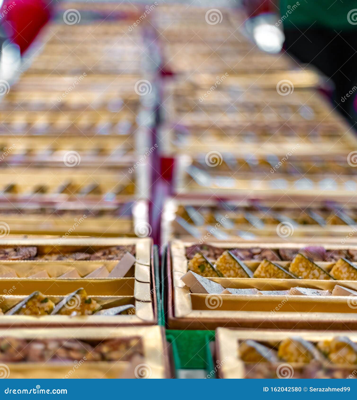 A Mixture of Various Indian Sweets Packed in a Box. Peda, Laddu, Mithai ...