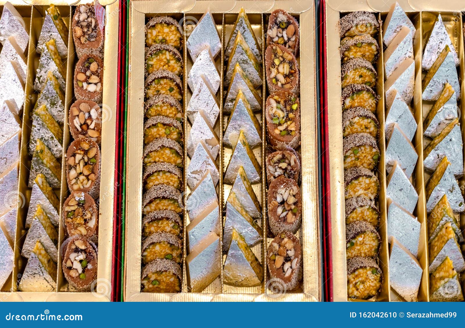 A Mixture of Various Indian Sweets Packed in a Box. Peda, Laddu, Mithai ...