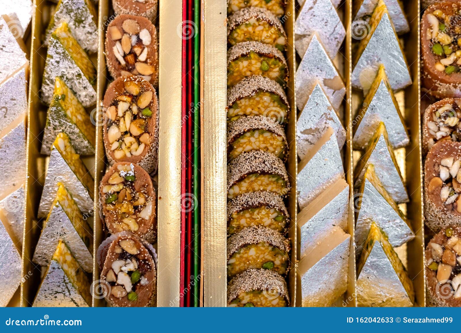 A Mixture of Various Indian Sweets Packed in a Box. Peda, Laddu, Mithai ...