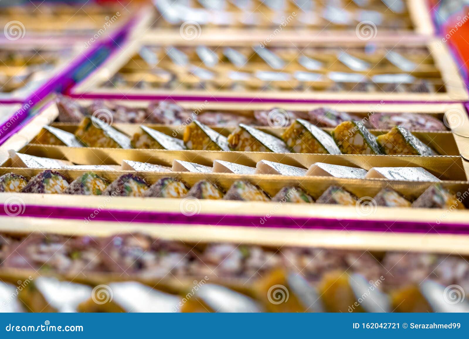 A Mixture of Various Indian Sweets Packed in a Box. Peda, Laddu, Mithai ...