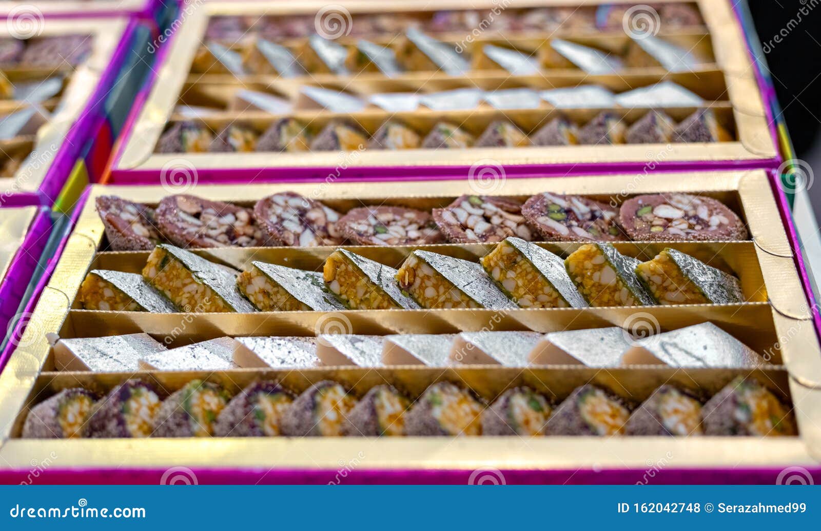 A Mixture of Various Indian Sweets Packed in a Box. Peda, Laddu, Mithai ...
