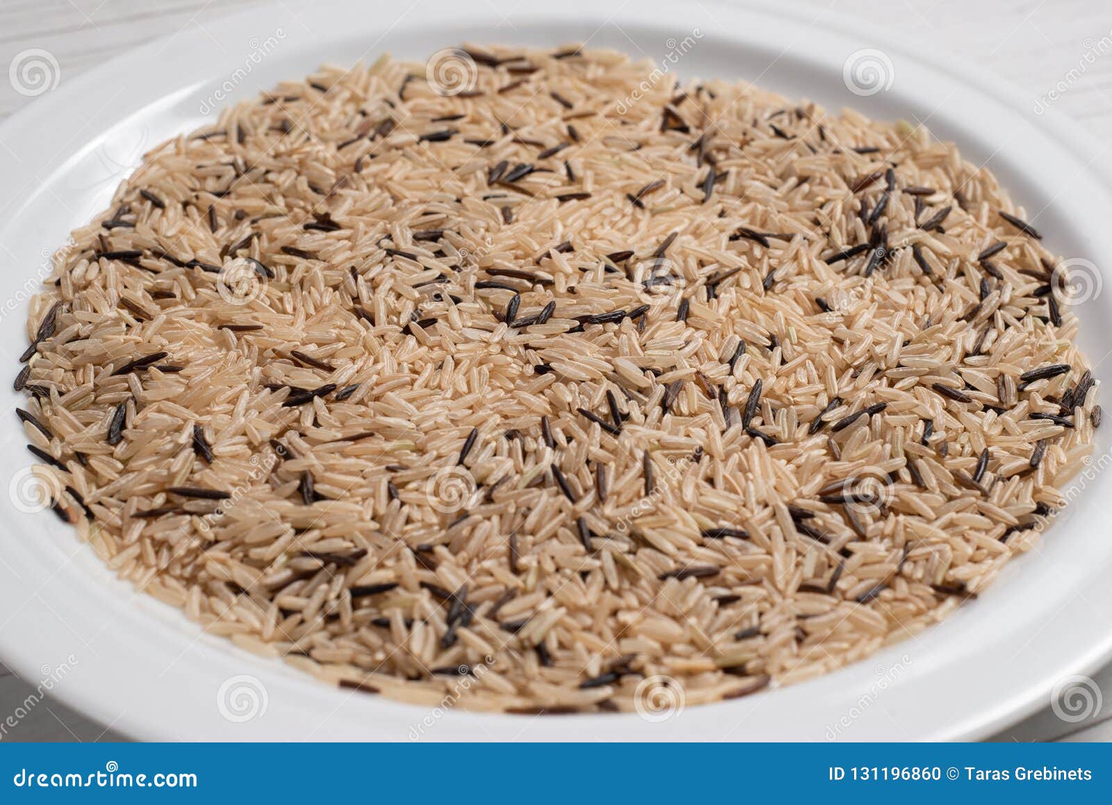 A Mixture of Wild and Unpolished Rice on a White Plate Stock Photo ...