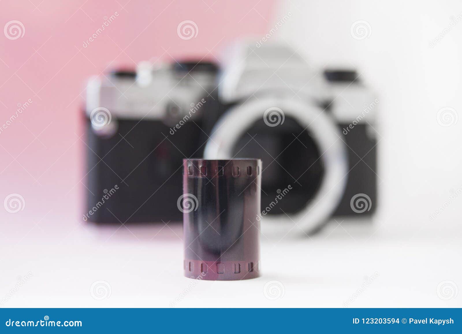 35 Mm Negative Film Roll on Blurry SLR Camera Background Stock Photo ...