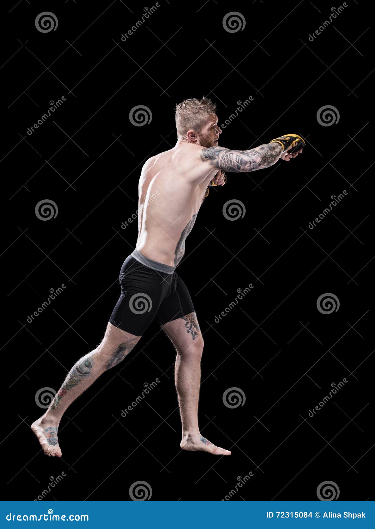 MMA Fighter Practising Punching on Black Background Stock Photo - Image ...