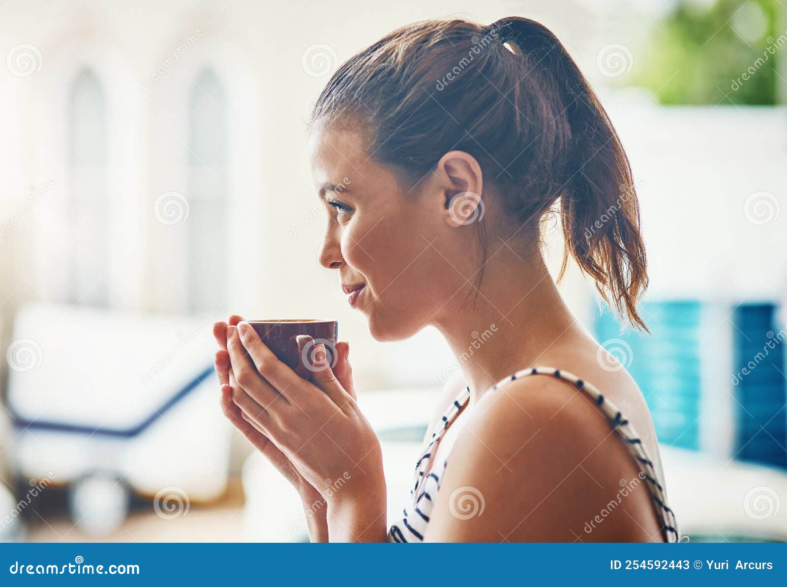 Mmm...coffee. a Relaxed Young Woman Having a Cup of Coffee at a Cafe ...