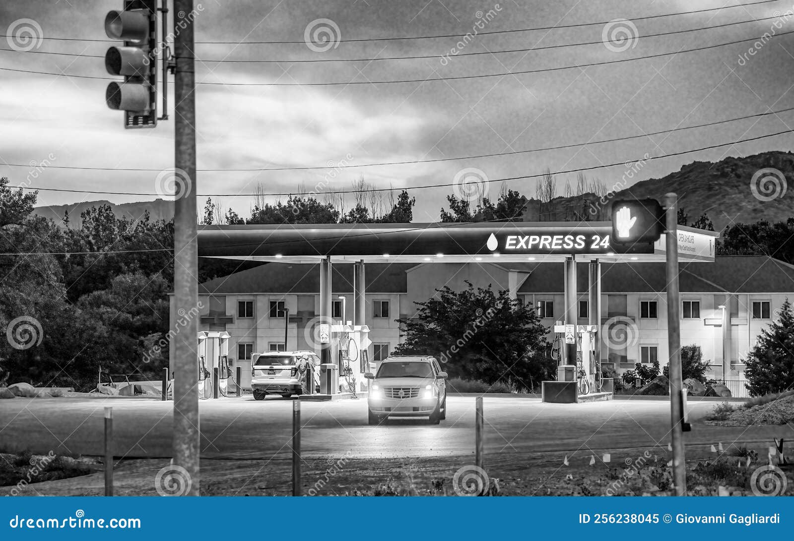 MOAB, UT - JUNE 22, 2018: Express 24 Gas Station Sign at Sunset ...