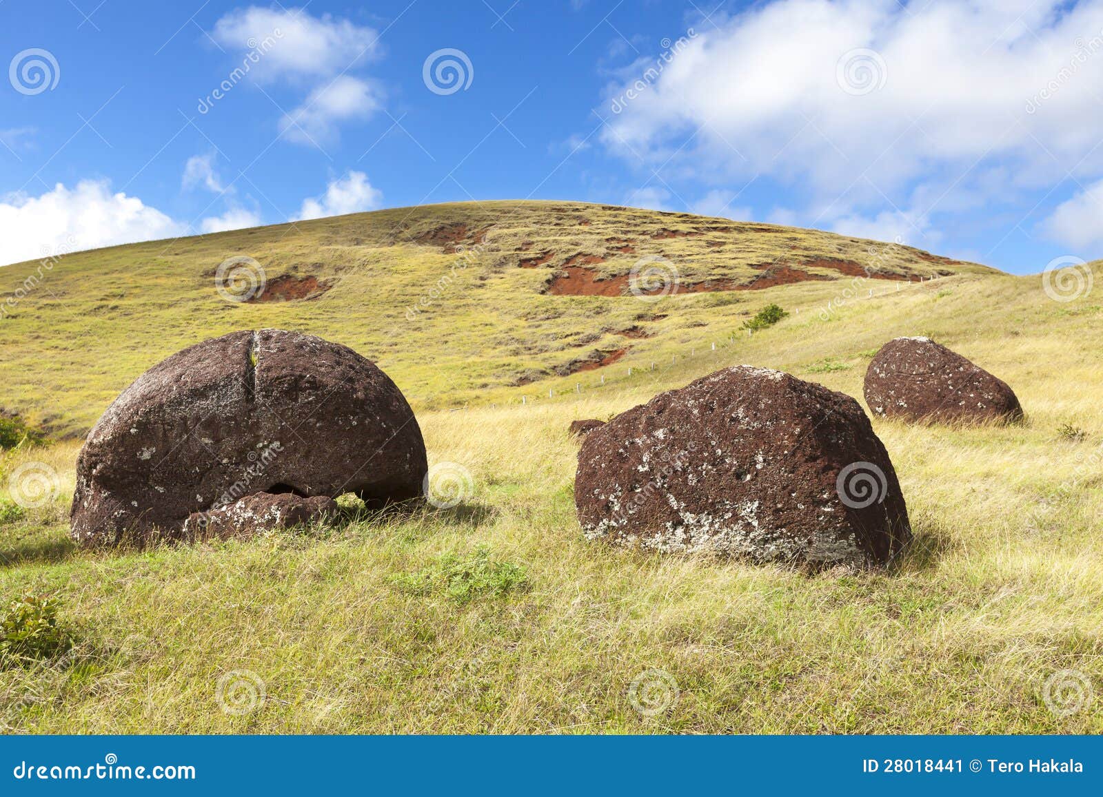 Moai Hats on Hillside in Easter Island Stock Image - Image of clouds ...