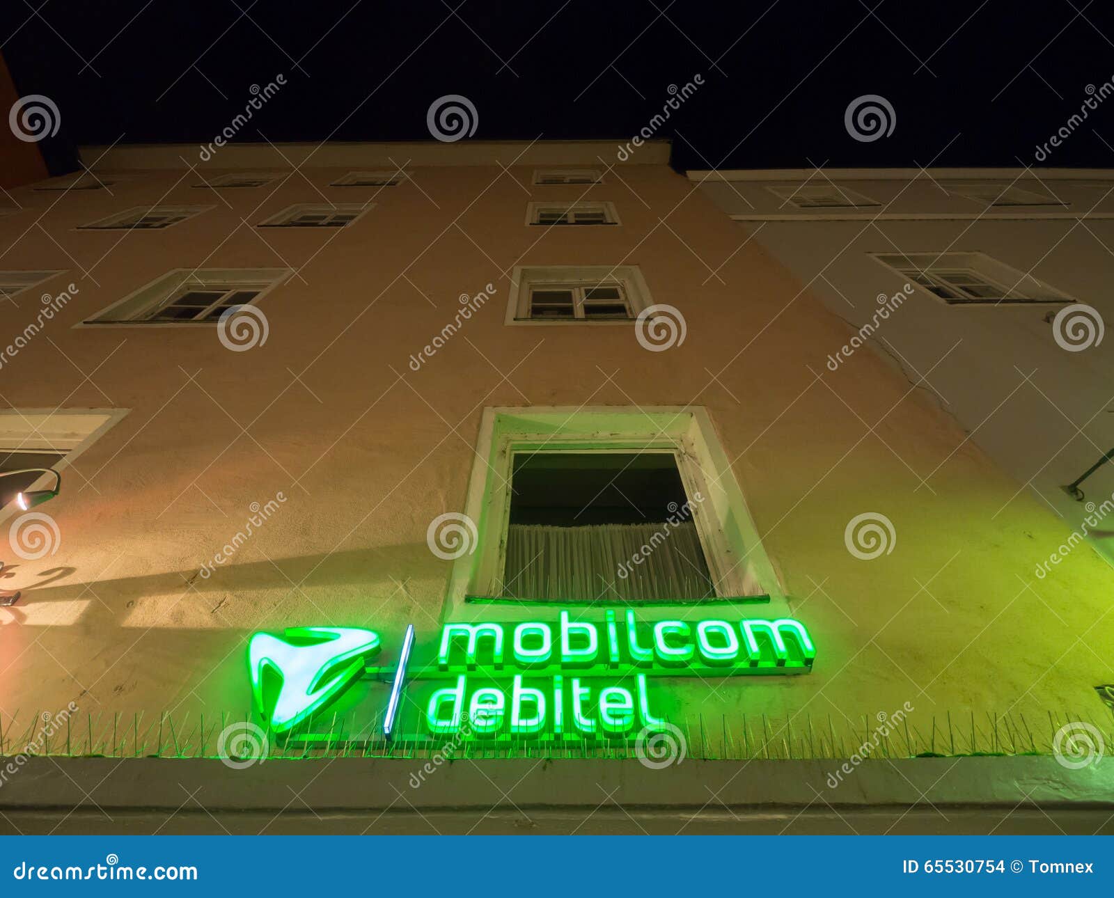 Mobilcom Debitel at night editorial stock image. Image of night - 65530754