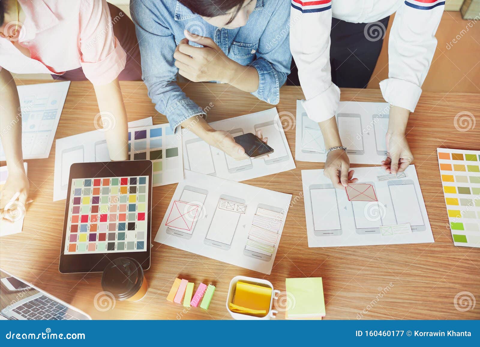 Mobile Apps Developers Team Designing, Discussing Together on a UI/UX ...