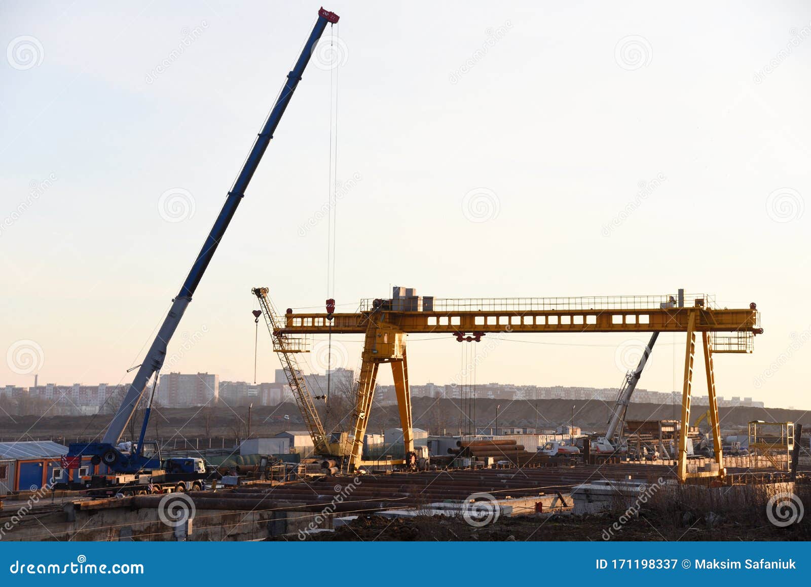 Mobile Auto Cranes Working At Construction Site. Digging A Pit For The ...