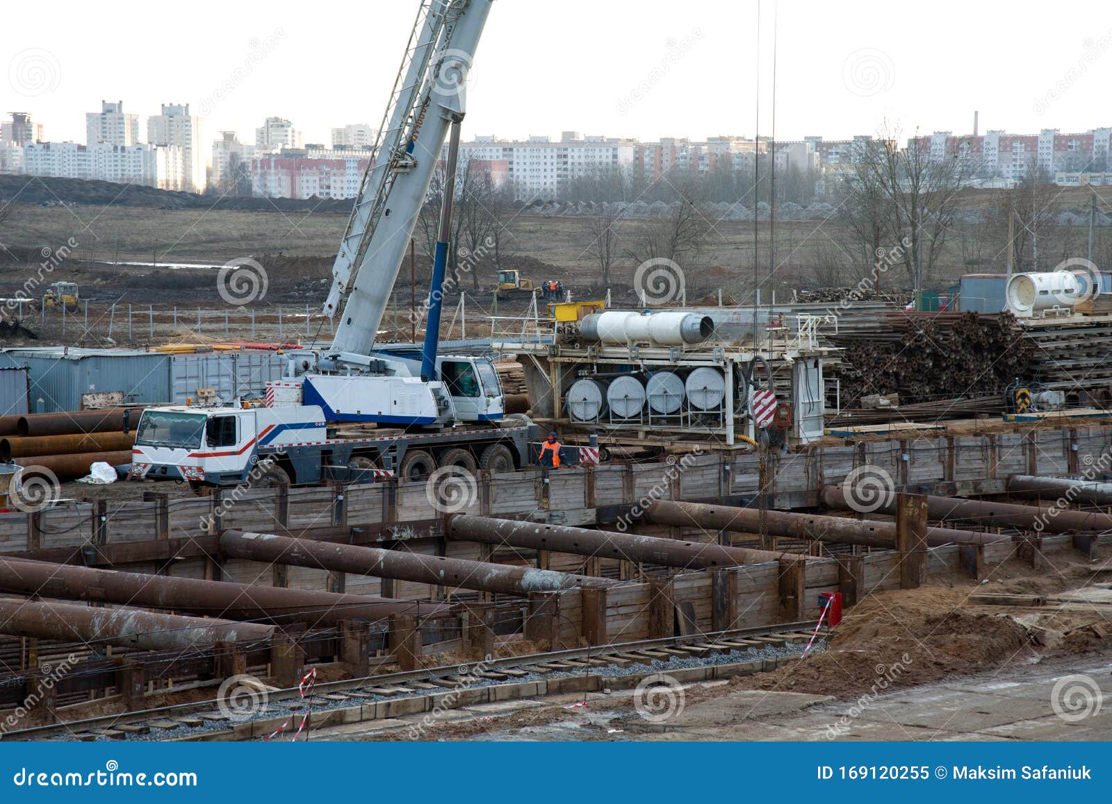 Mobile Auto Cranes Working at Construction Site. Digging a Pit for the ...