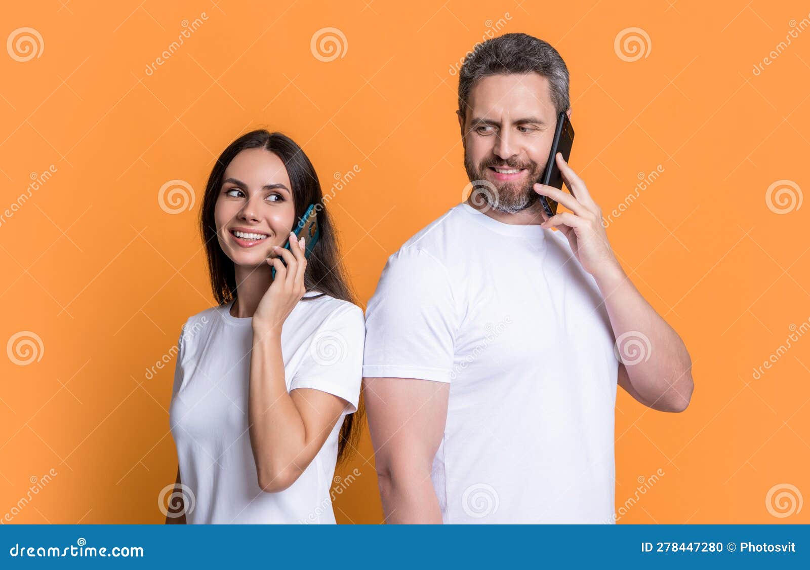 Mobile Communication of Glad Couple at Studio. Couple Talking on Mobile ...