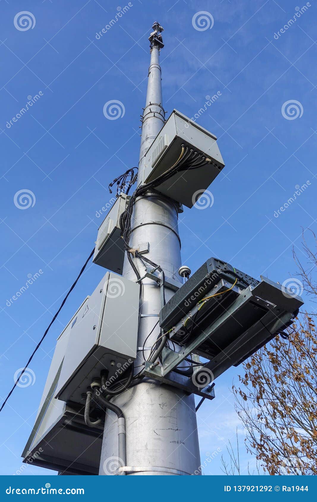 Mobile Communications Antenna Tower Against the Blue Sky Stock Photo ...