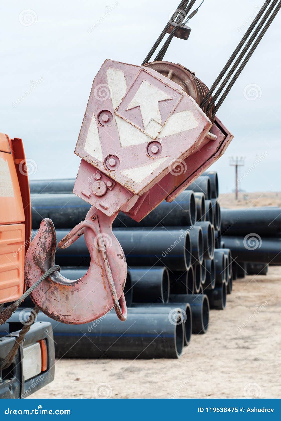 Construction Crane Hook with Some Industrial Buildings on the Ba Stock ...