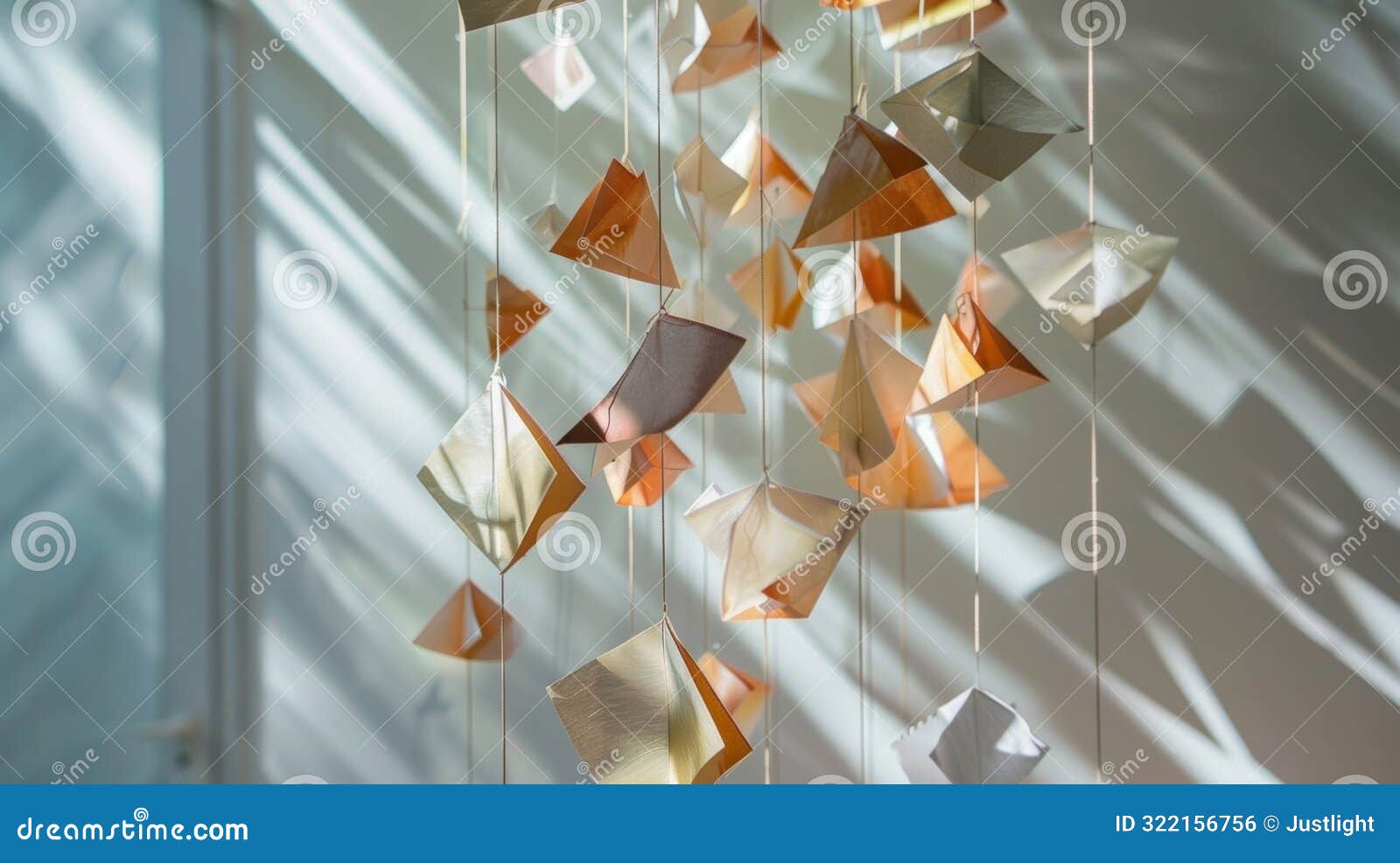 A Mobile Made from Various Types of Recycled Paper Dangling from the ...