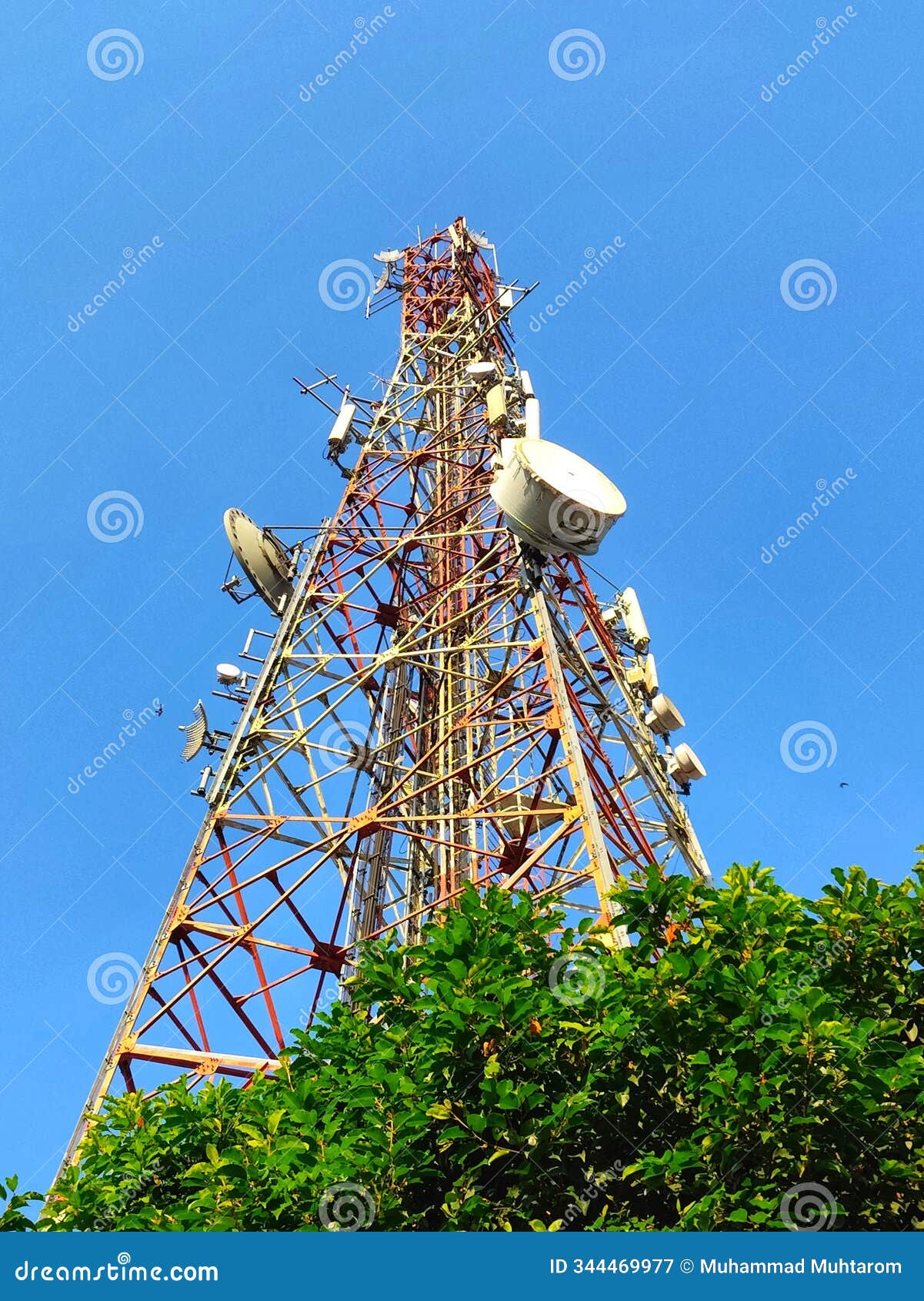 A Mobile Operator Tower. Against the Backdrop of a Bright Blue Sky ...