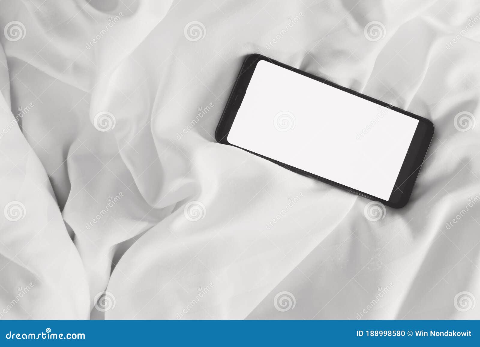 Mobile phone on bed stock photo. Image of fluffy, cellphone - 188998580