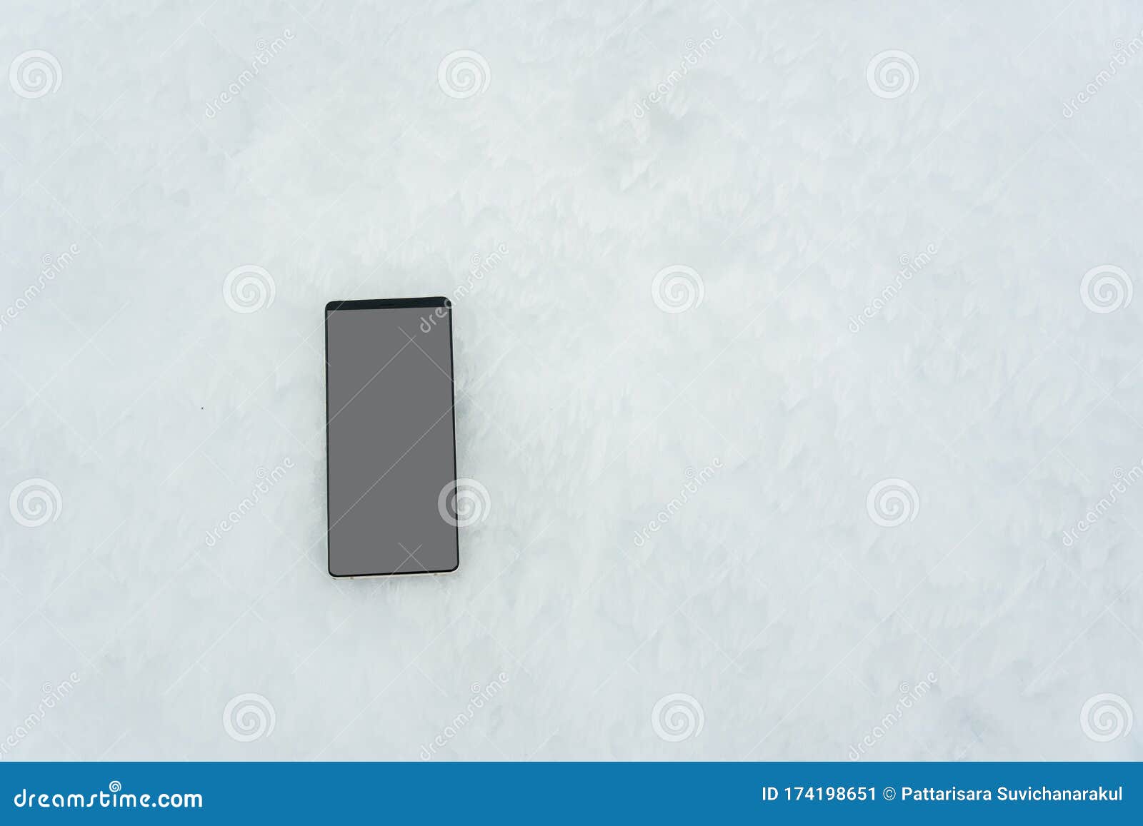 Mobile Phone with Blank Screen on the Winter Snow on the Ground. Top ...