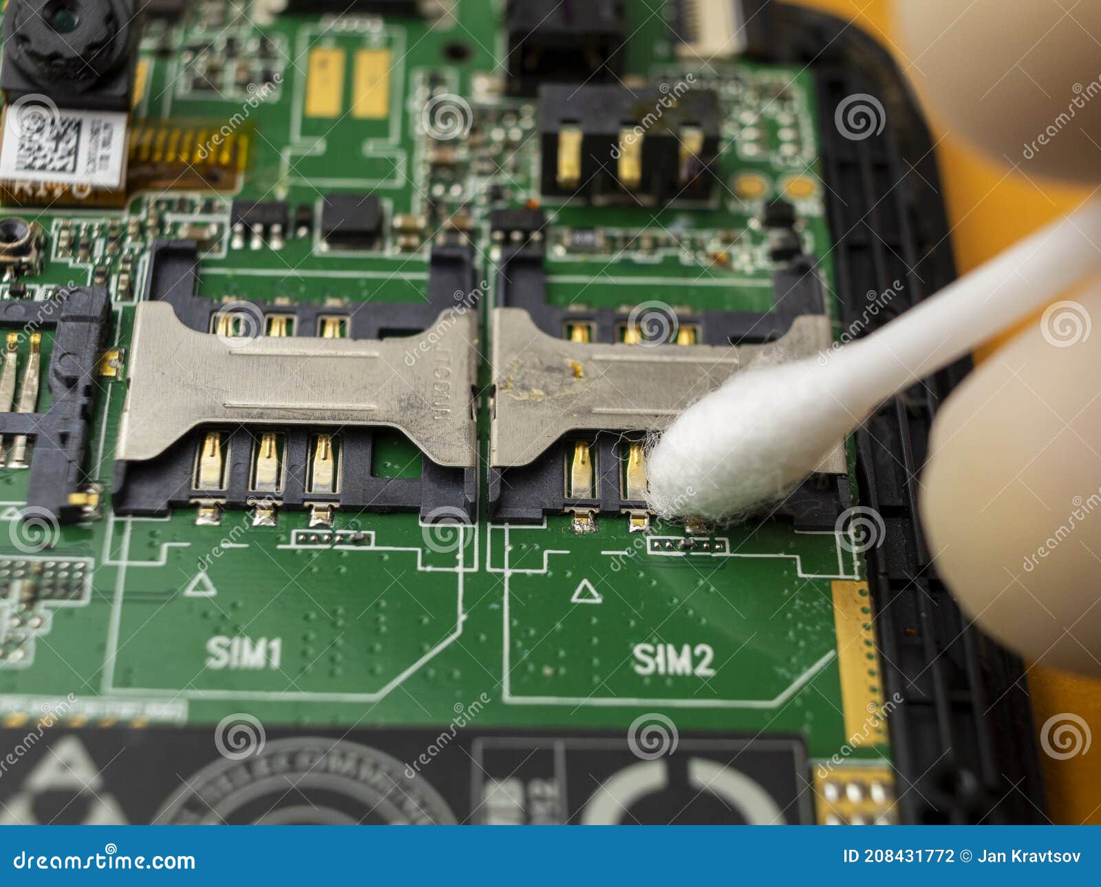 Cleaning a Mobile Phone with a Brush and Microfiber Stock Photo - Image ...