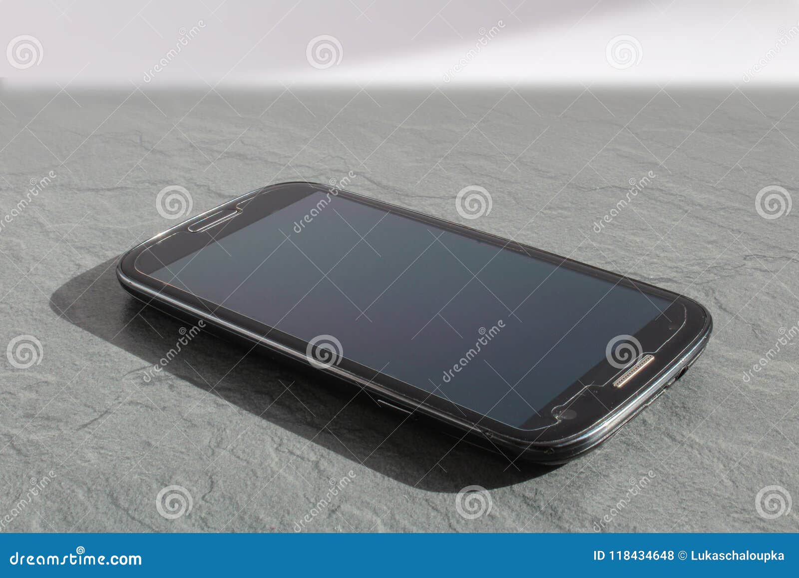 Mobile Phone on Dark Grey Stone Texture Stock Photo - Image of holding ...