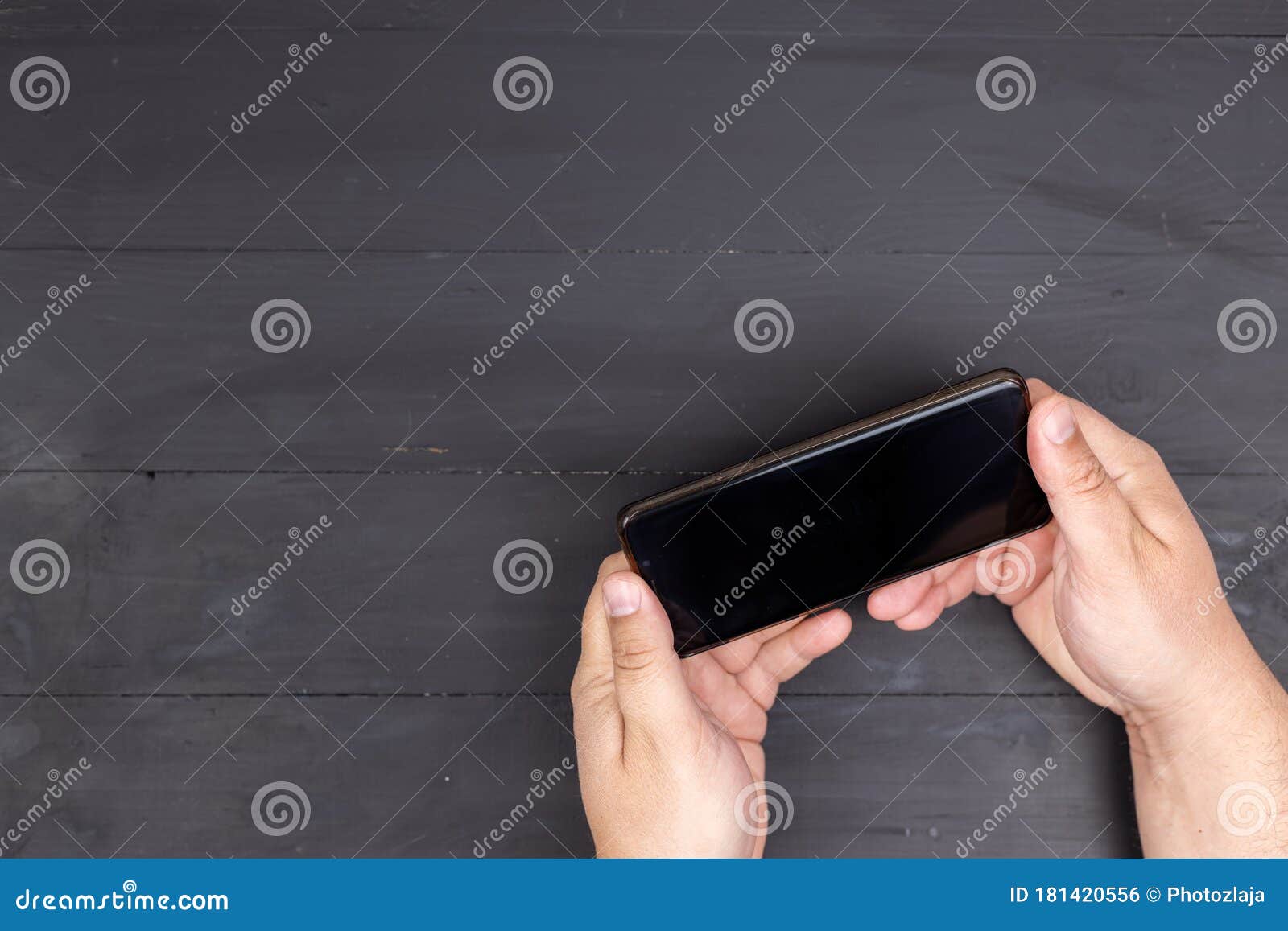 Mobile Phone with Empty Black Screen in the Male Hands Above Black ...