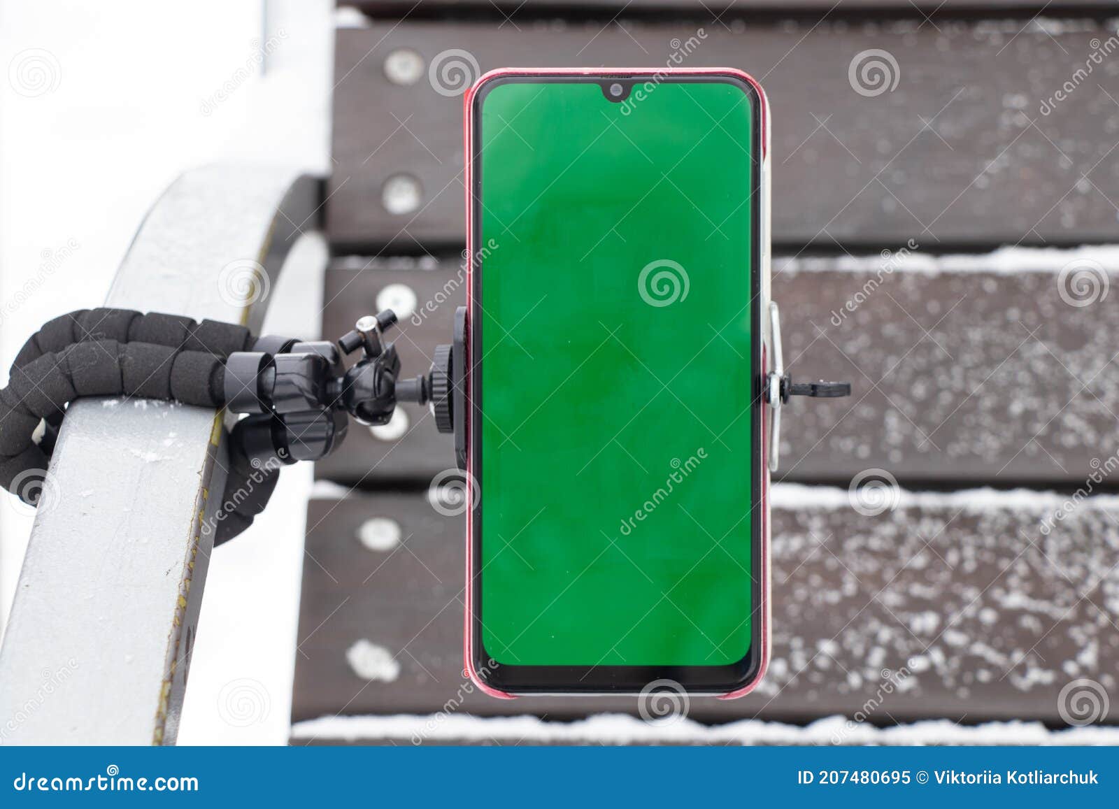 Mobile Phone with a Green Screen Fixed on a Flexible Stand on the ...